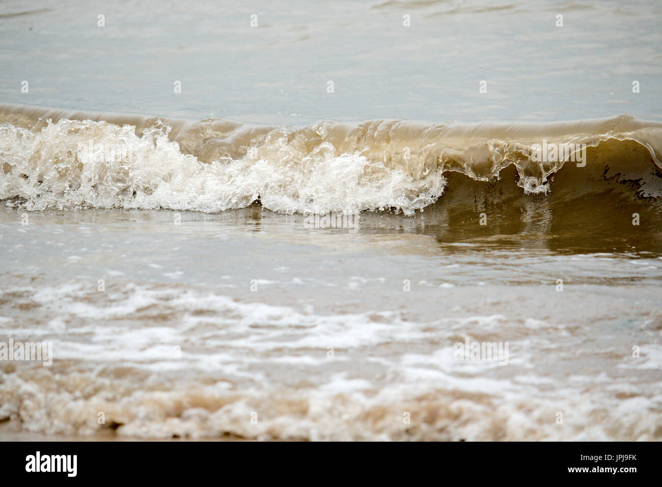Wave breaking on the banks of the Taw and Torridge river estuary, North ...