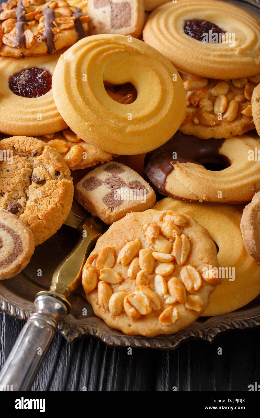 Biscuit mix with various fillings on a plate close up, vertical Stock ...
