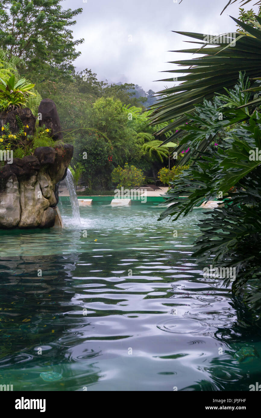relaxing hot mineral pools in La Fortuna Costa Rica with green tropical ...