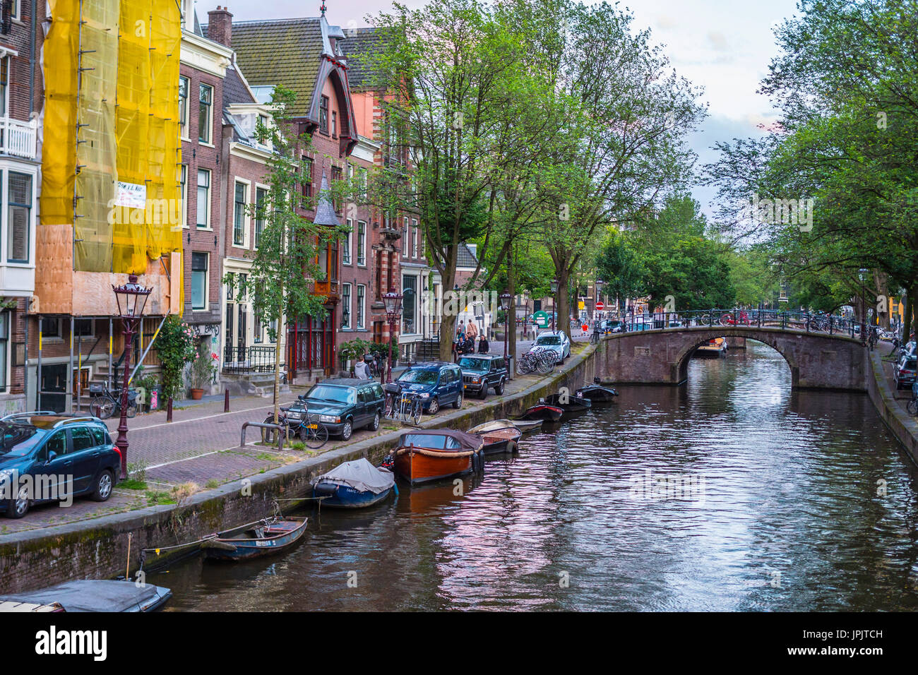 The beautiful city of Amsterdam with its canals and small houses ...