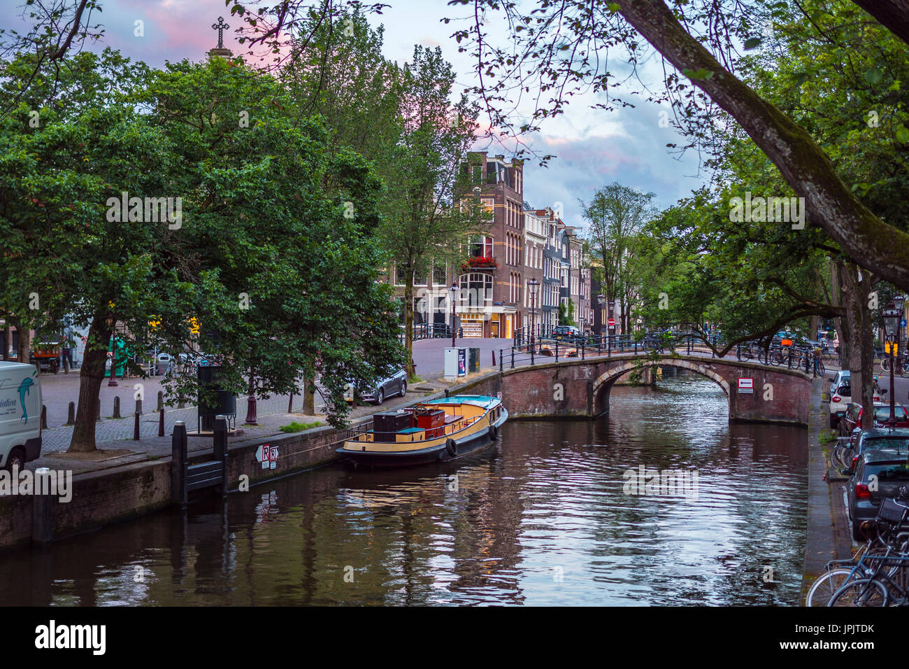 The beautiful city of Amsterdam with its canals and small houses ...