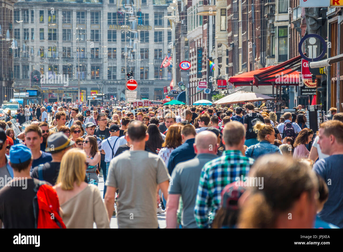 Huge crowd of people at Damrak Street in Amsterdam - AMSTERDAM - THE ...