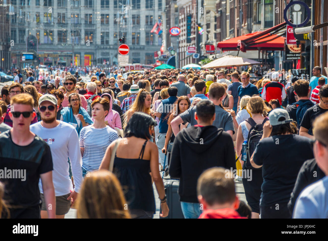 Huge crowd of people at Damrak Street in Amsterdam - AMSTERDAM - THE ...