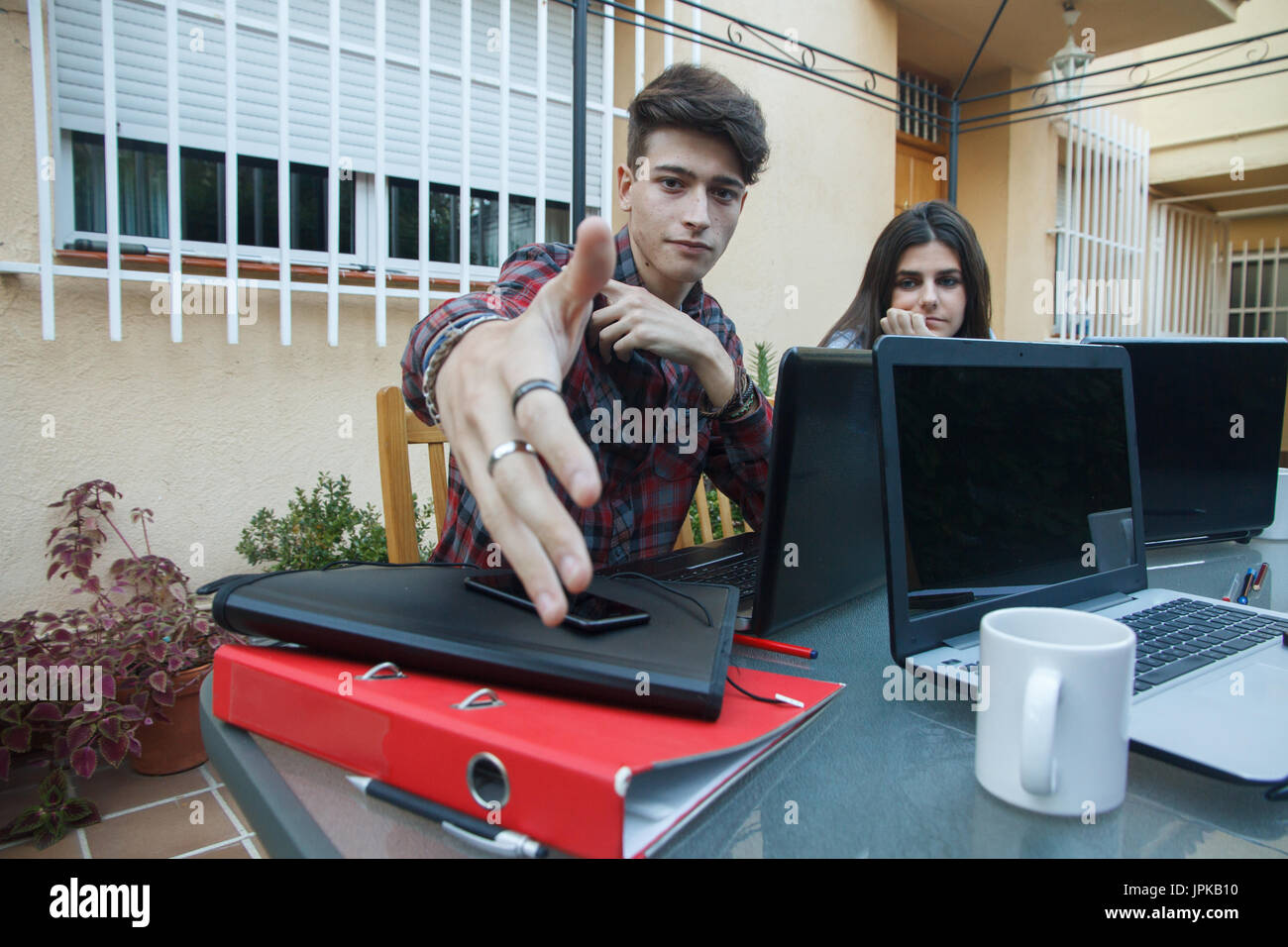 Young enterprising man holding out his hand to greet before starting ...