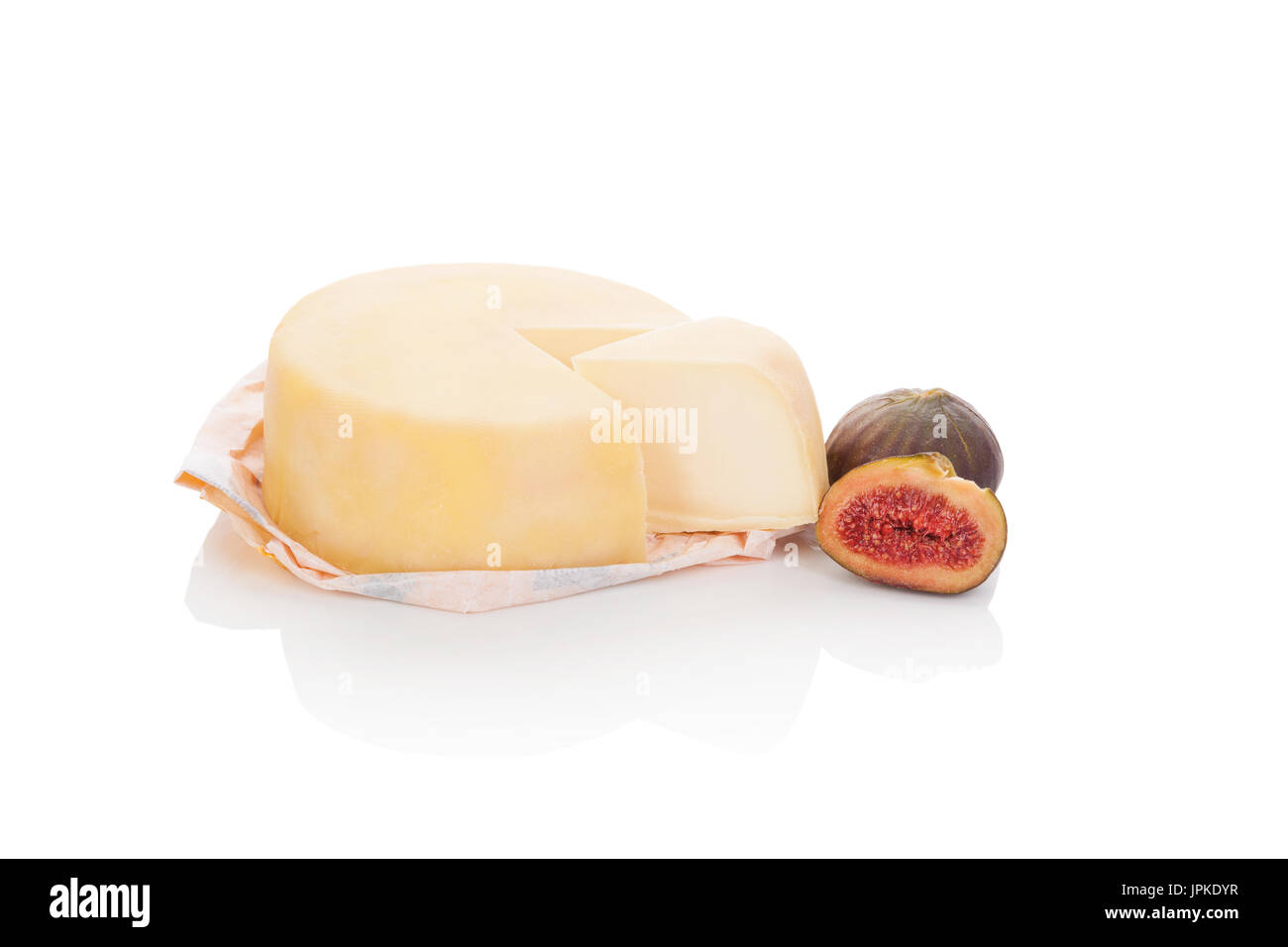 Delicious cheese with sliced fig, isolated on white background ...