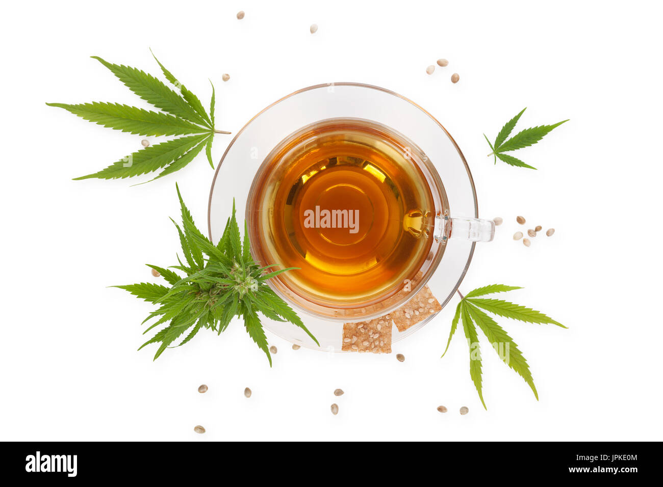 Cannabis tea with crackers from above with cannabis plant and leaves ...