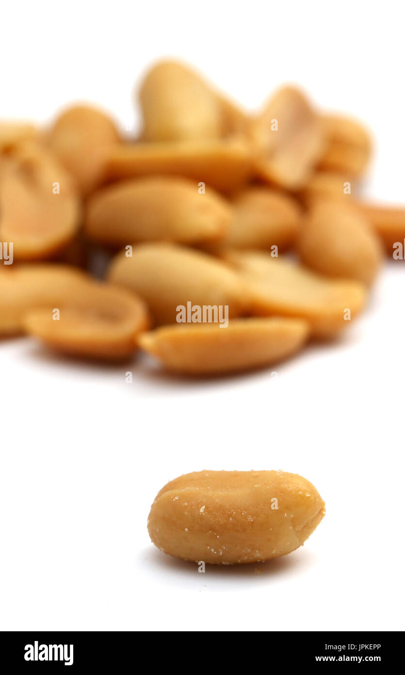 Unshelled salted peanuts isolated on a white background Stock Photo - Alamy