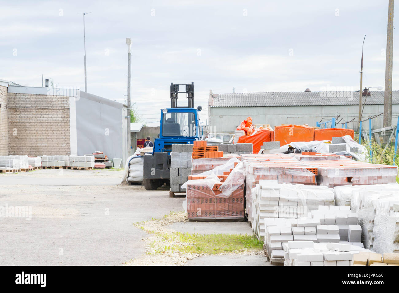 Open base construction with building materials Stock Photo - Alamy