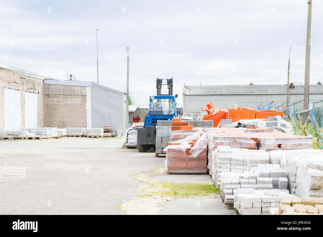 Open base construction with building materials Stock Photo - Alamy