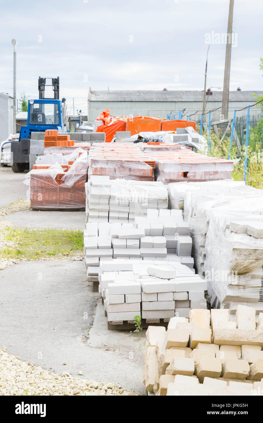 Open base construction with building materials Stock Photo - Alamy