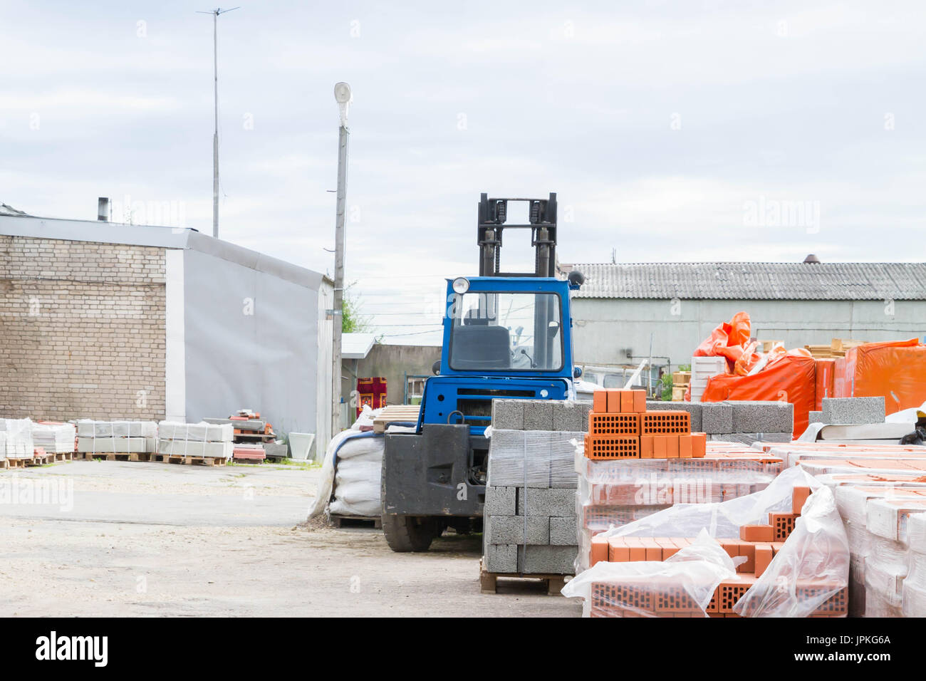 Open base construction with building materials Stock Photo - Alamy