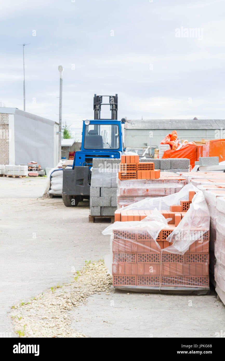 Open base construction with building materials Stock Photo - Alamy