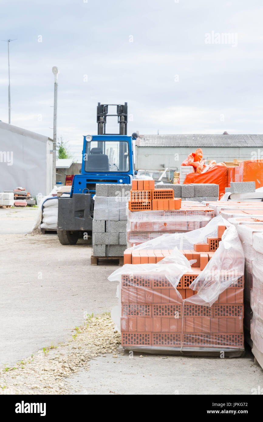 Open base construction with building materials Stock Photo - Alamy