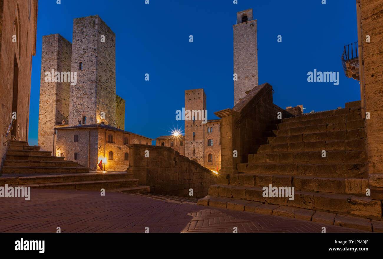 night view of amazing medieval towers in the Italian town of San ...