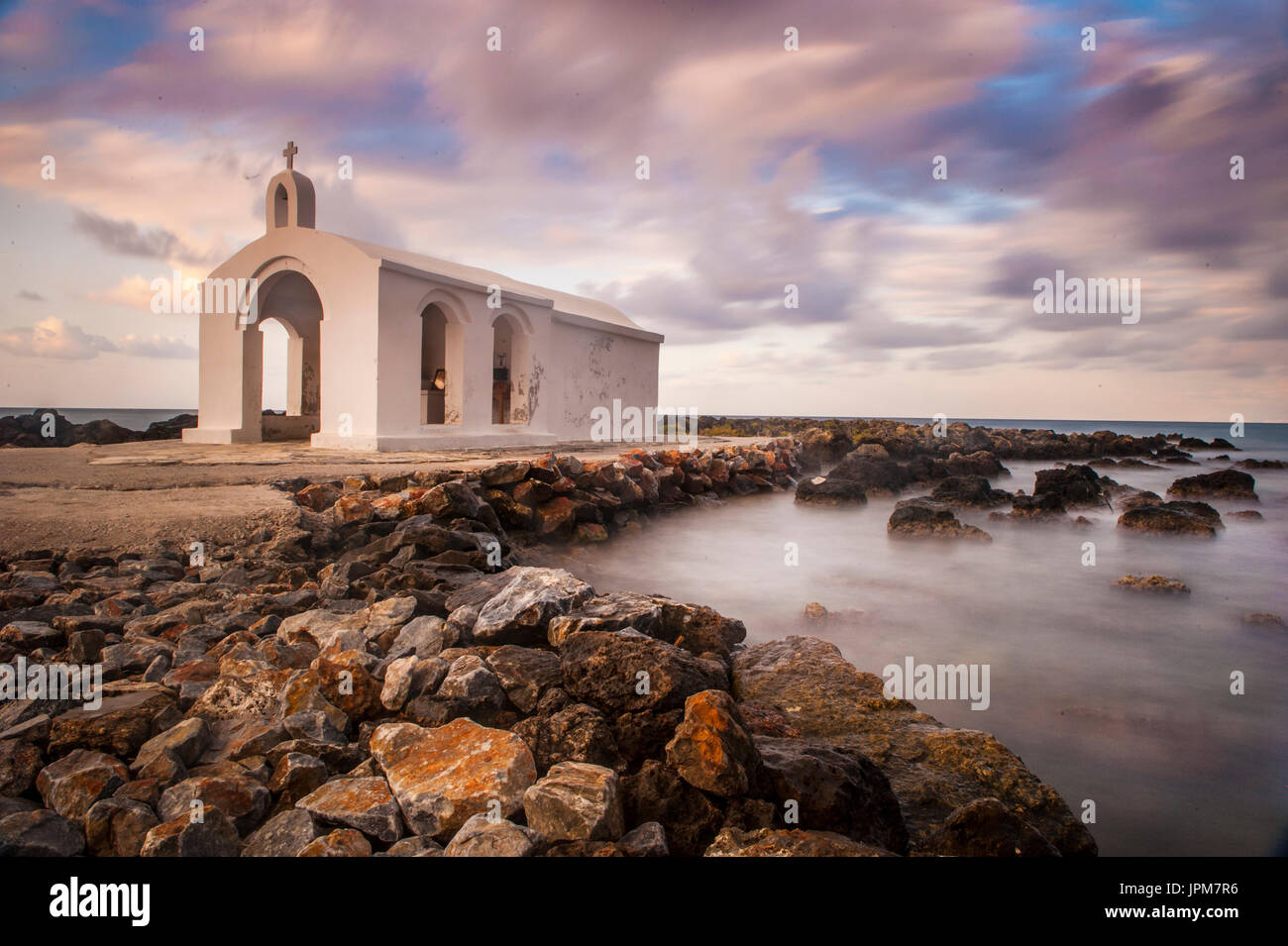 St Nicholas Chapel, a small white chapel in the sea near Georgioupolis ...