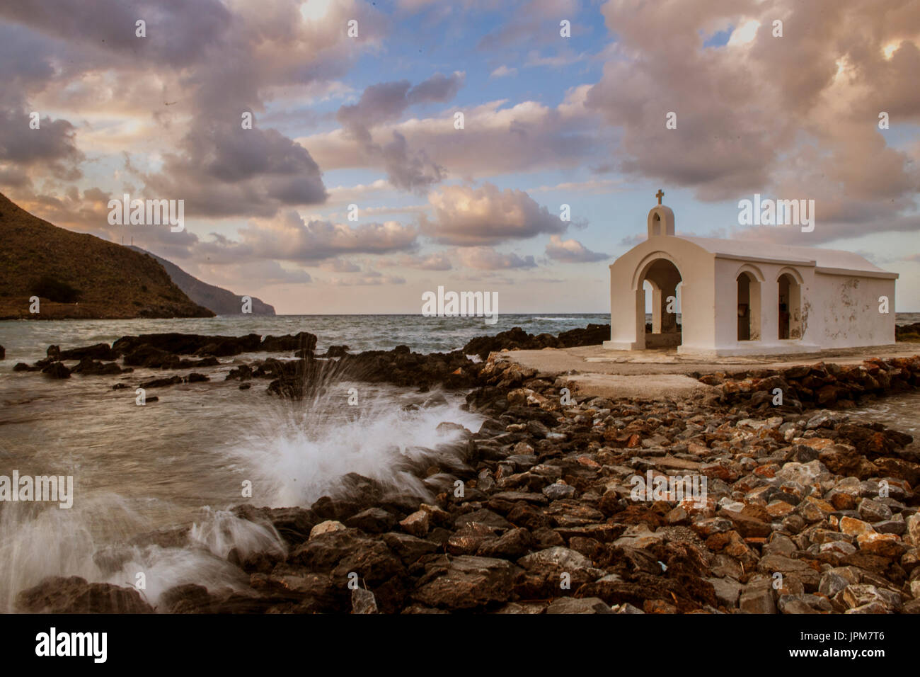 St Nicholas Chapel, a small white chapel in the sea near Georgioupolis ...