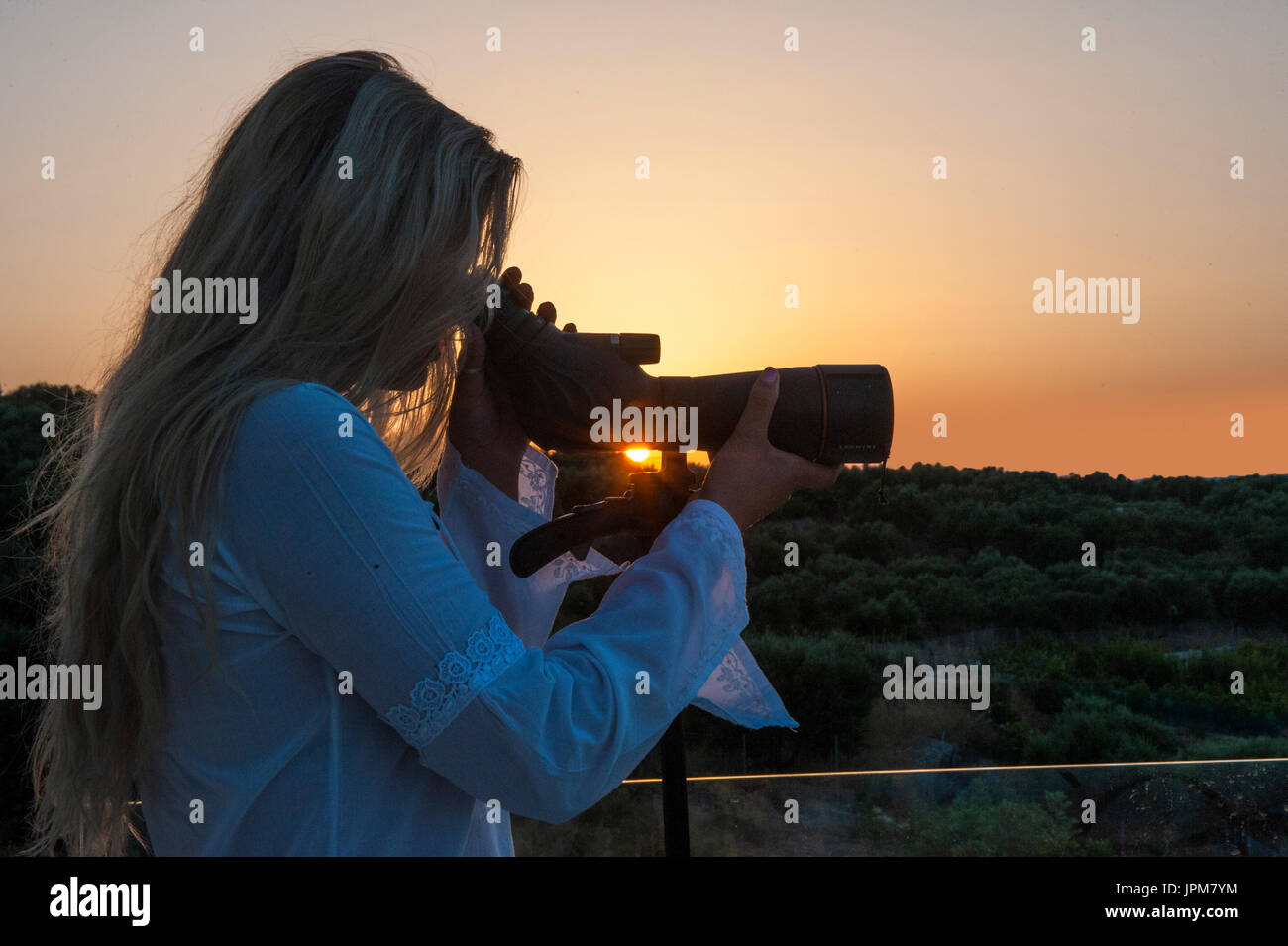 Girl looking through viewing scope hi-res stock photography and images ...