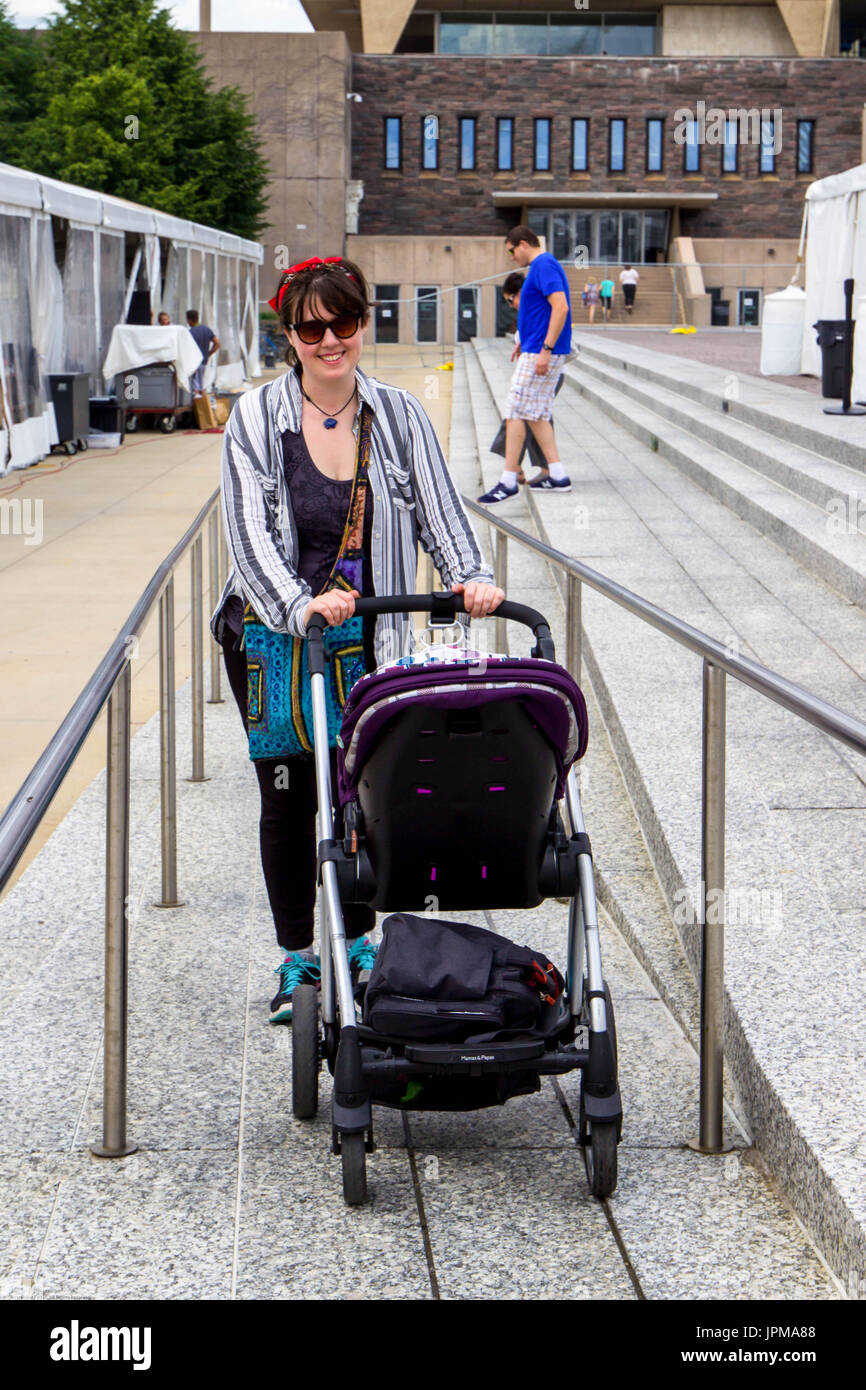 Boy pushing stroller hi-res stock photography and images - Alamy