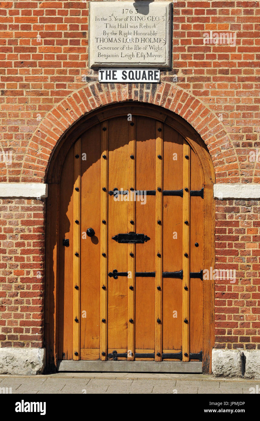 The large wooden fortified door on the town hall or village hall at ...
