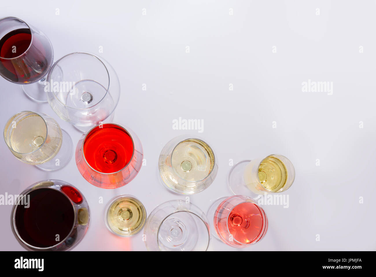 Glasses with red, white and rose wine, top view scene with copy space Stock Photo - Alamy