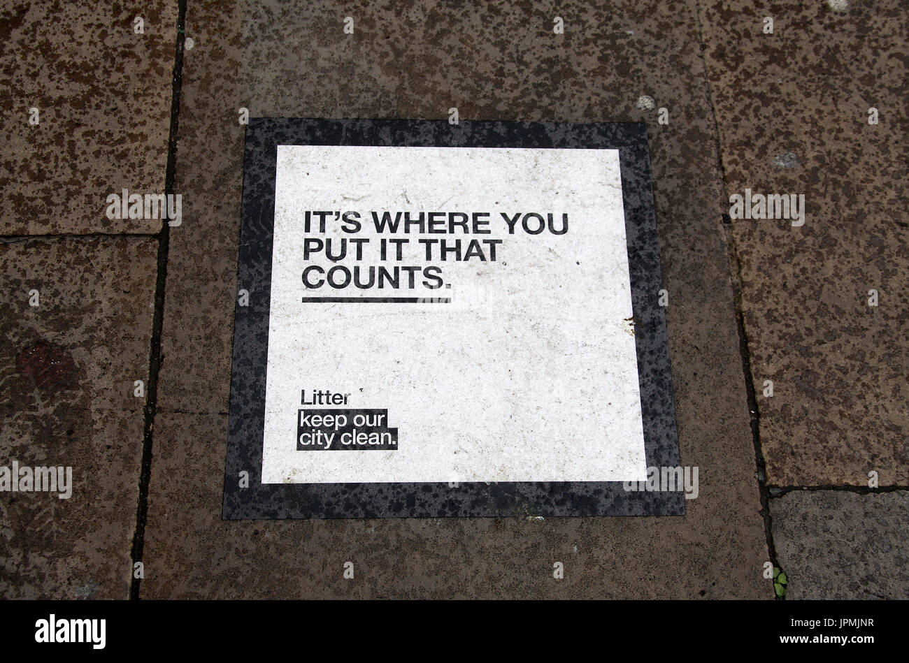 Litter poster on a Manchester pavement Stock Photo - Alamy