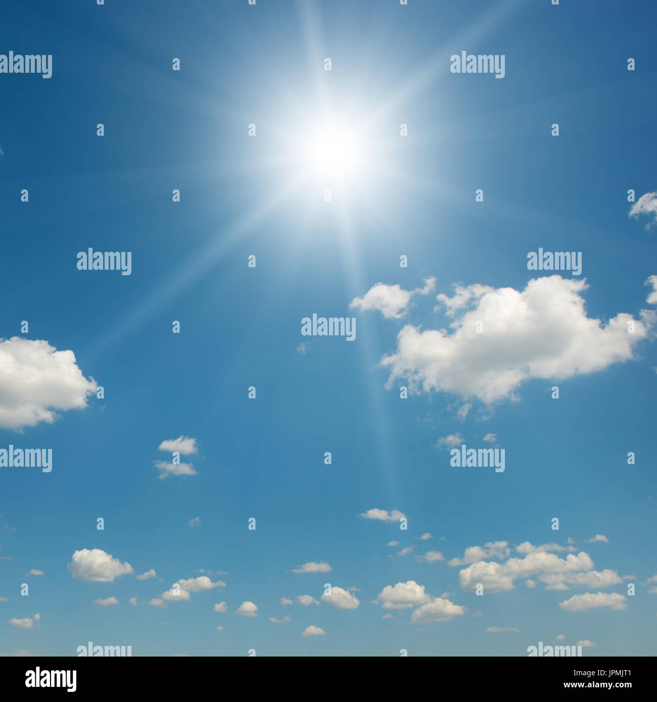 sun on beautiful blue sky Stock Photo - Alamy