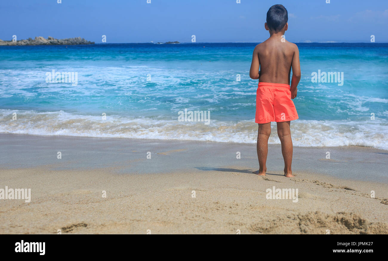 Young boy seeing the sea Stock Photo - Alamy