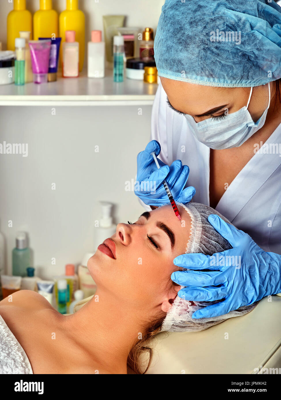 Filler injection for woman forehead face. Plastic aesthetic facial ...