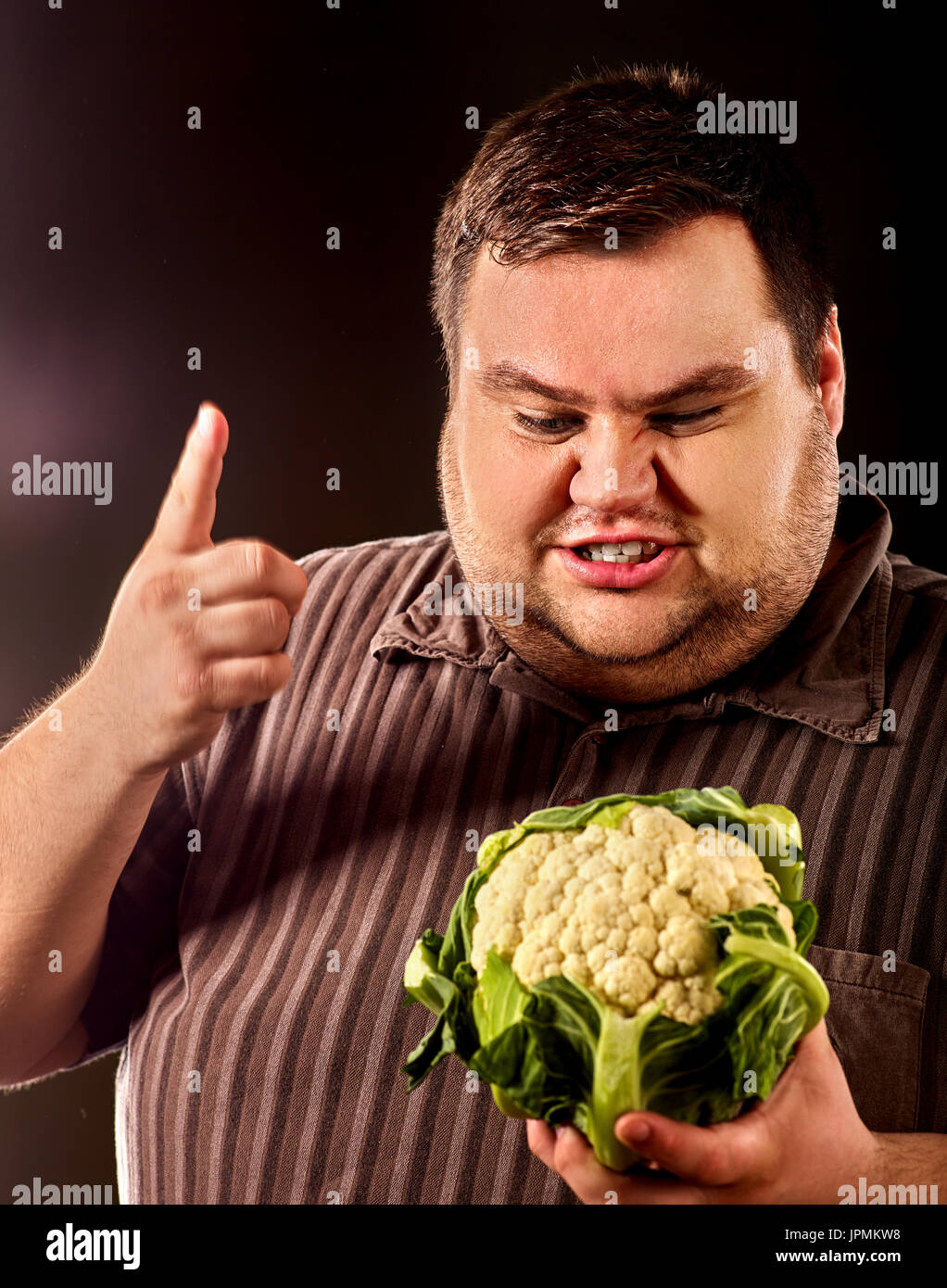 Diet fat man eating healthy food. Healthy breakfast with vegetables ...