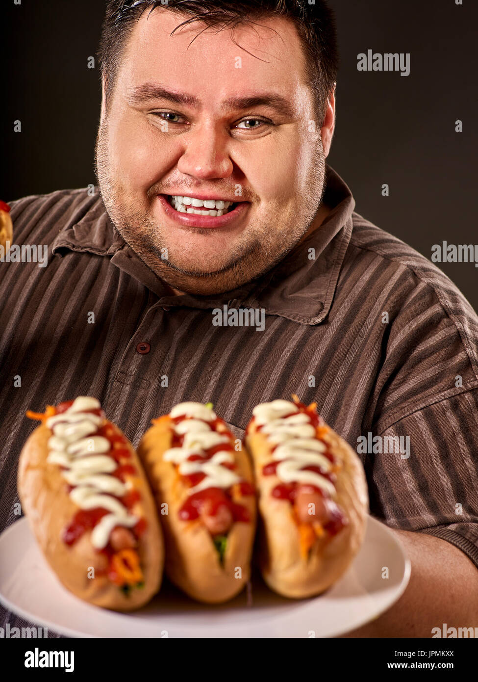 Fat Man Eating Chili Dogs