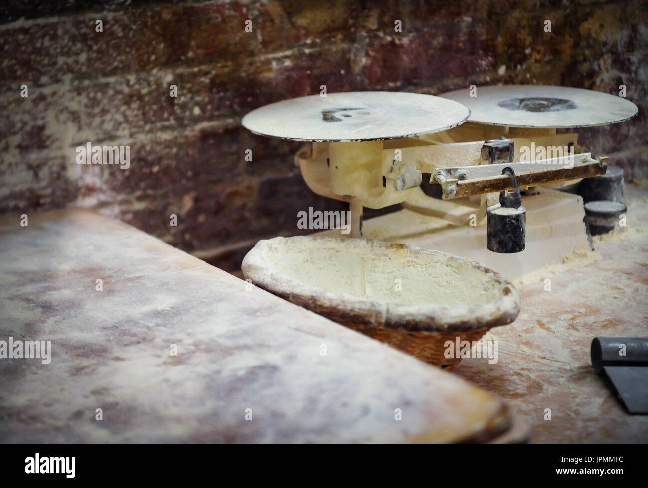 Bakery preparation table with bakery scales, dough boards, flour ...