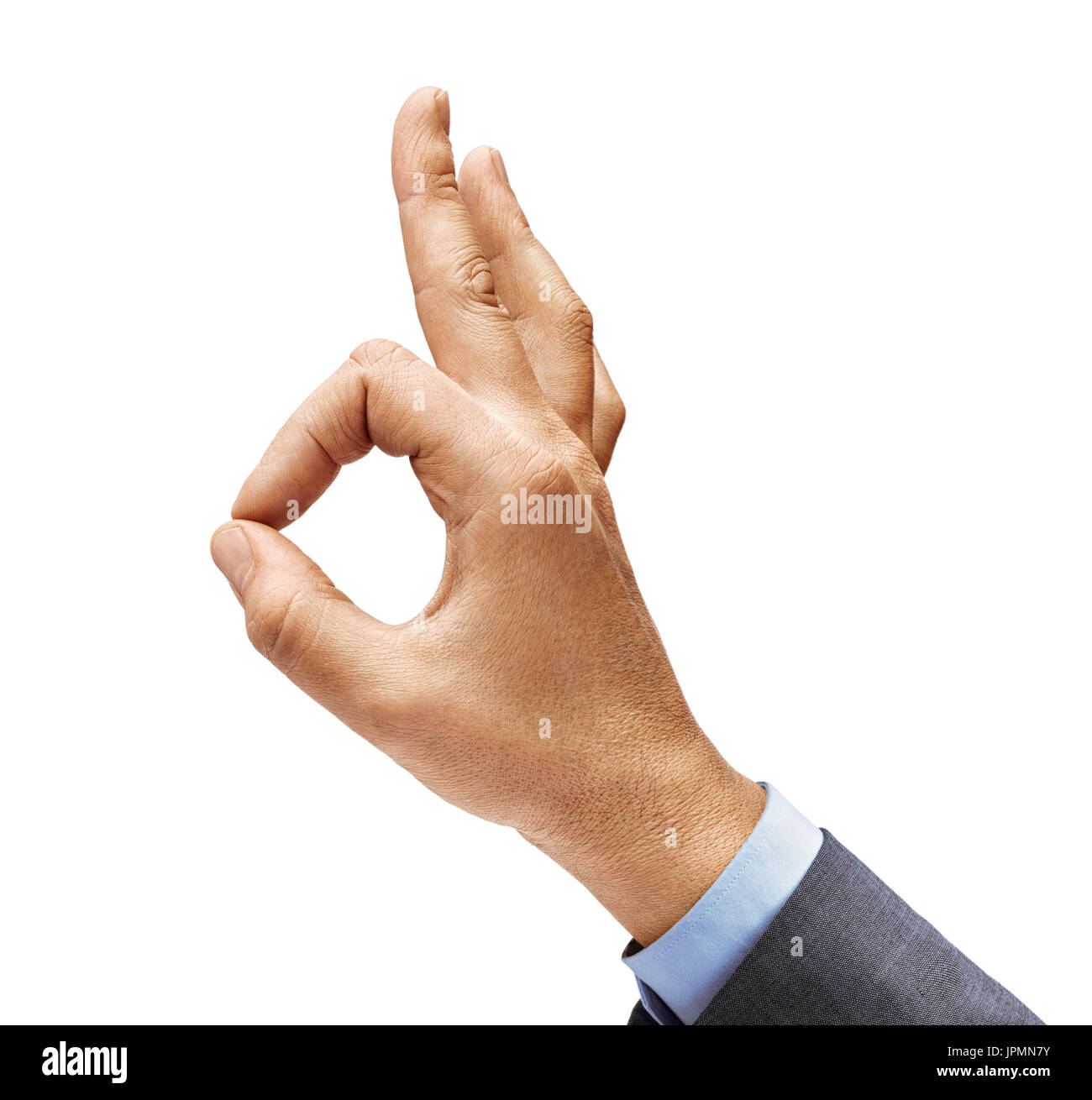 Man's hand in a suit shows gesture okay. Positive concept. Close up ...