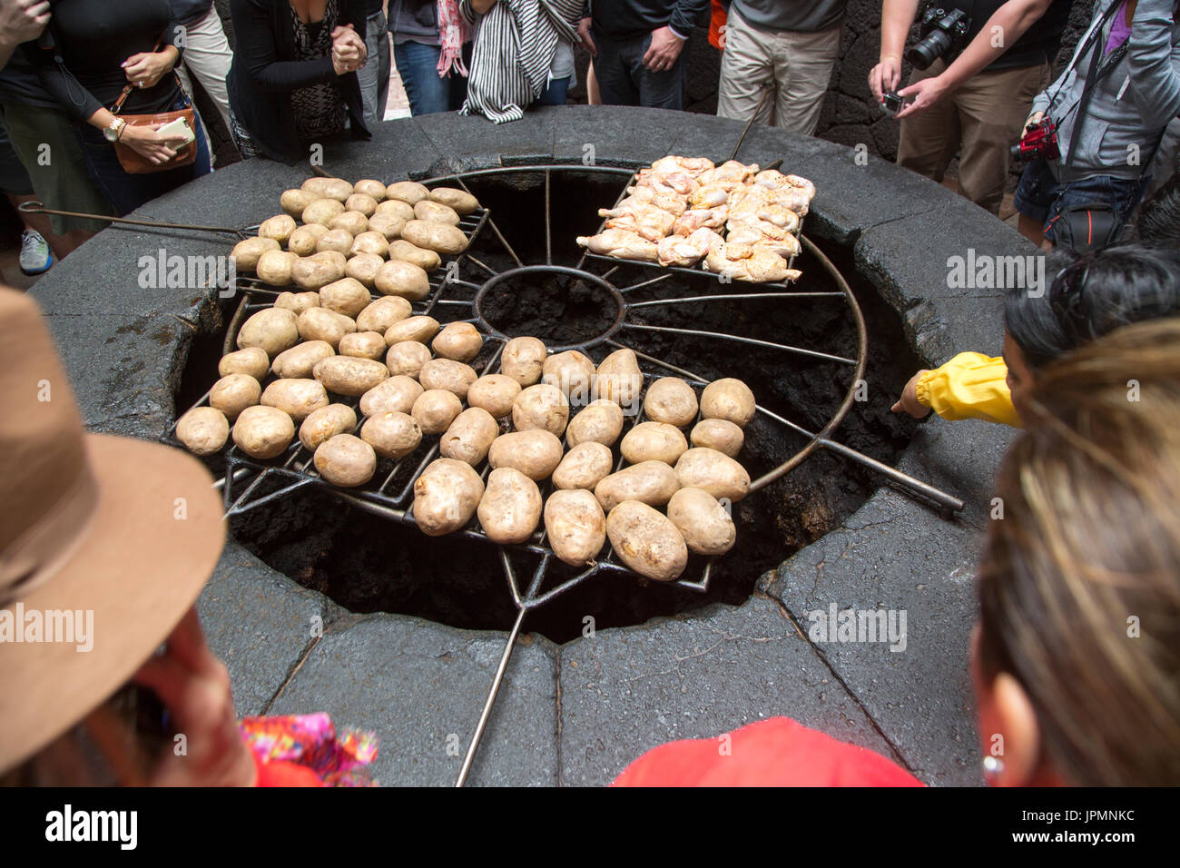 Food being cooked on volcanic grill at visitor centre, Parque Nacional ...