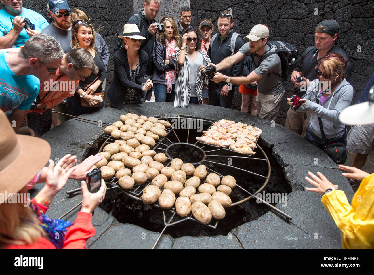 Food being cooked on volcanic grill at visitor centre, Parque Nacional ...