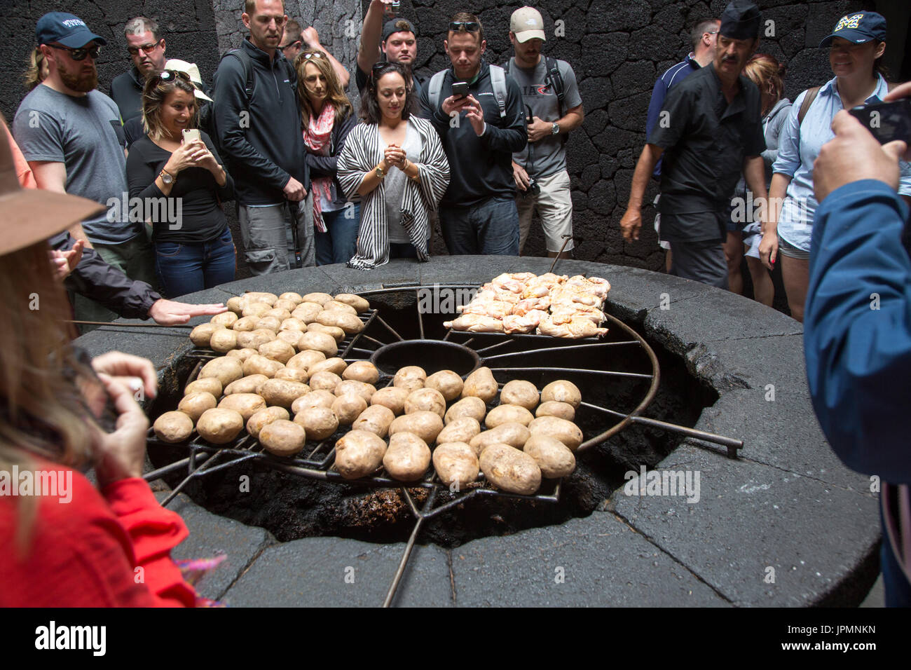 Food being cooked on volcanic grill at visitor centre, Parque Nacional ...