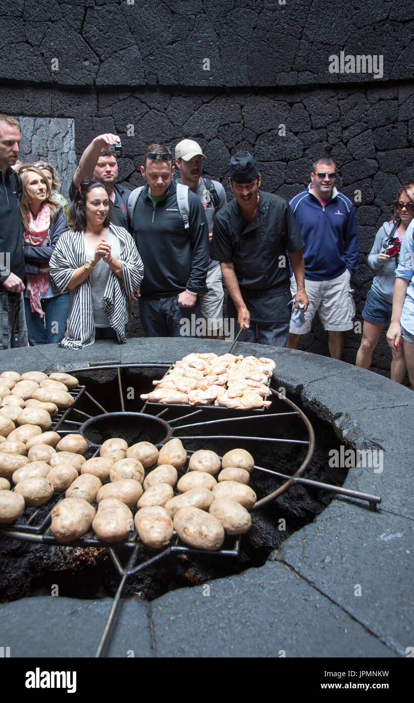 Food being cooked on volcanic grill at visitor centre, Parque Nacional ...