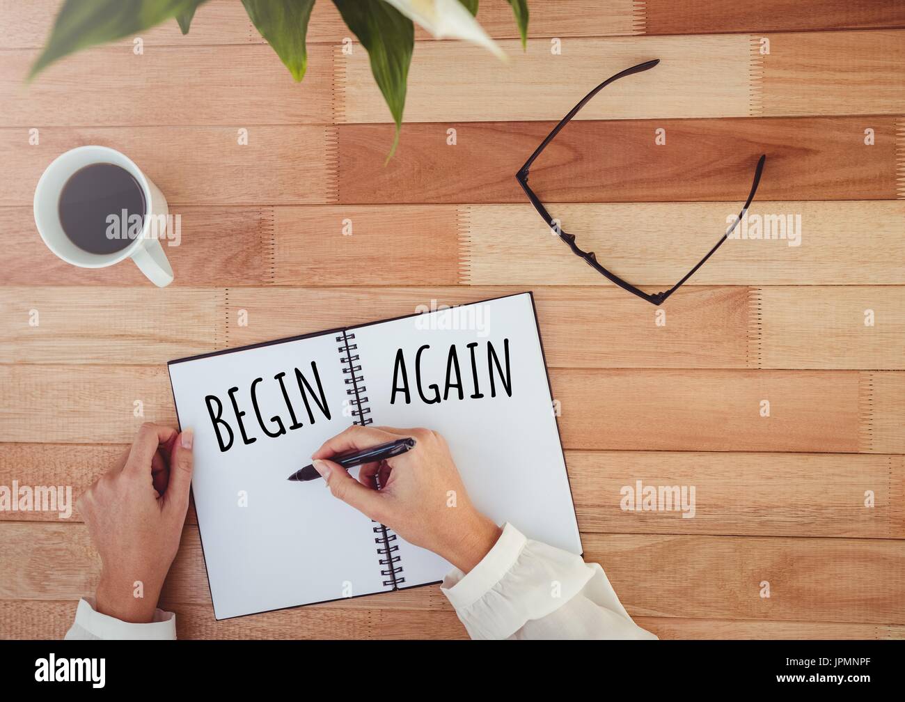Digital composite of Begin again text written on page with coffee and ...