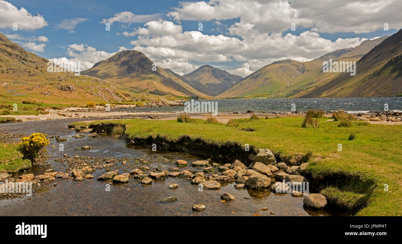 Vast Lake Wallpaper Clouds Over A Vast Lake With Town In The