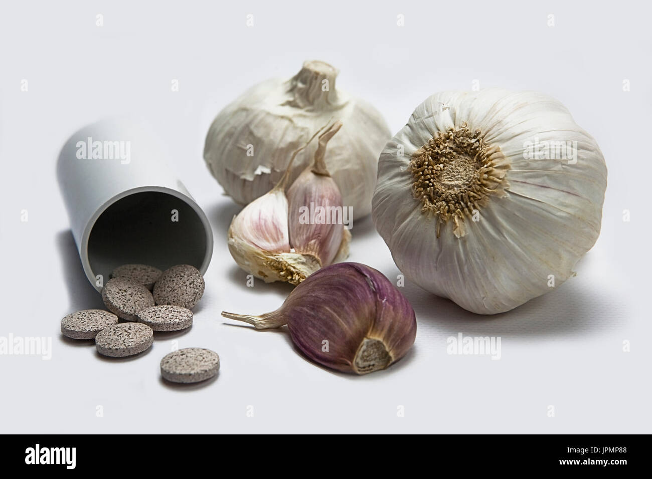 Garlic and herbal supplement pills, alternative medicine concept Stock ...