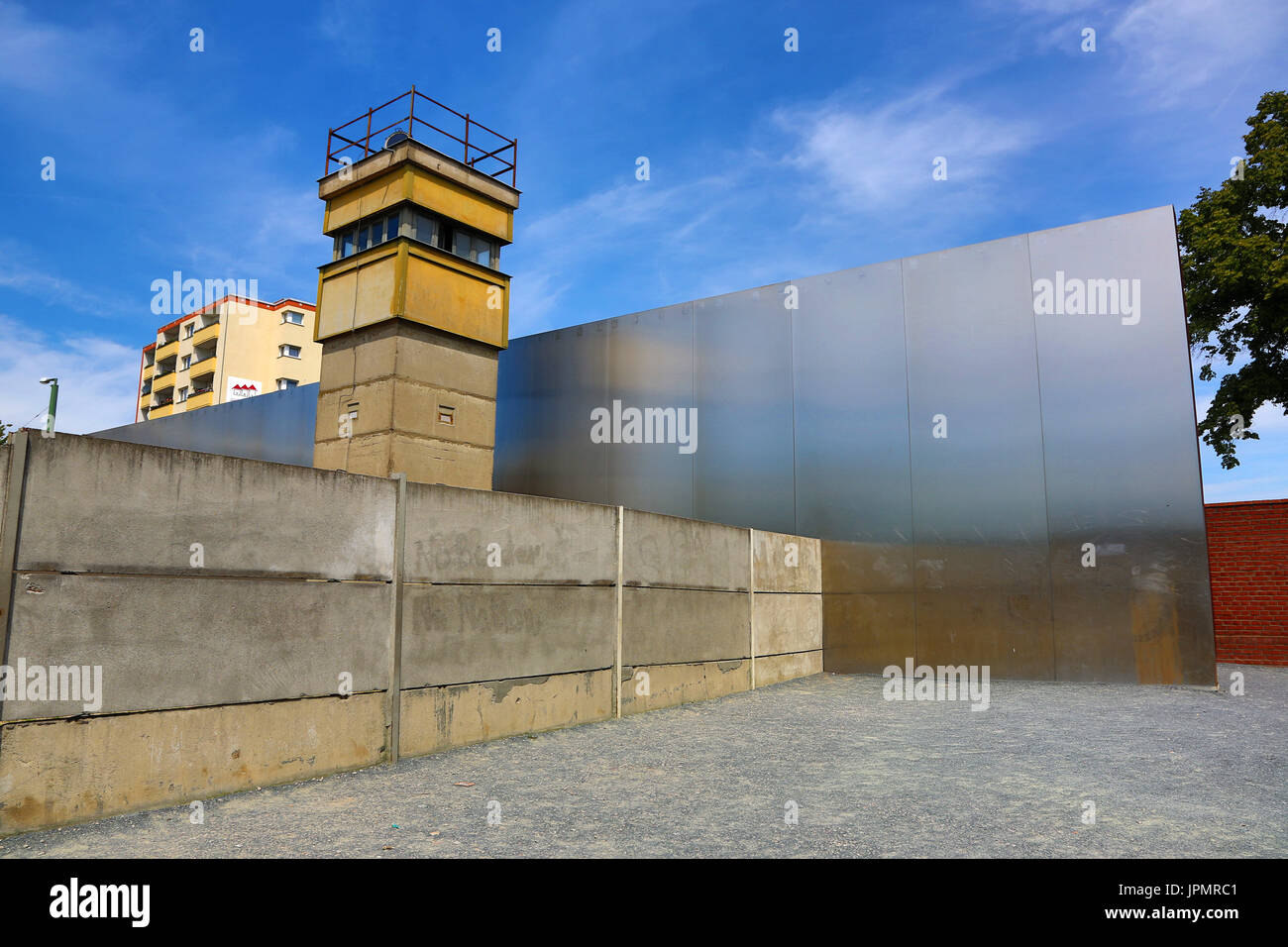 Preserved sections of the Berlin Wall and watchtower at the Berlin Wall ...