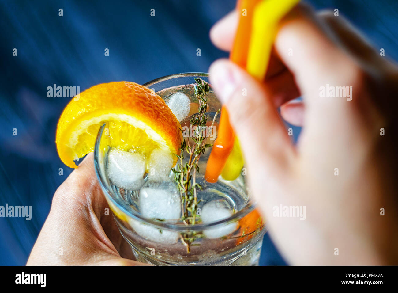 Alcoholic drink with vodka and soda. First-person view of a soft drink ...