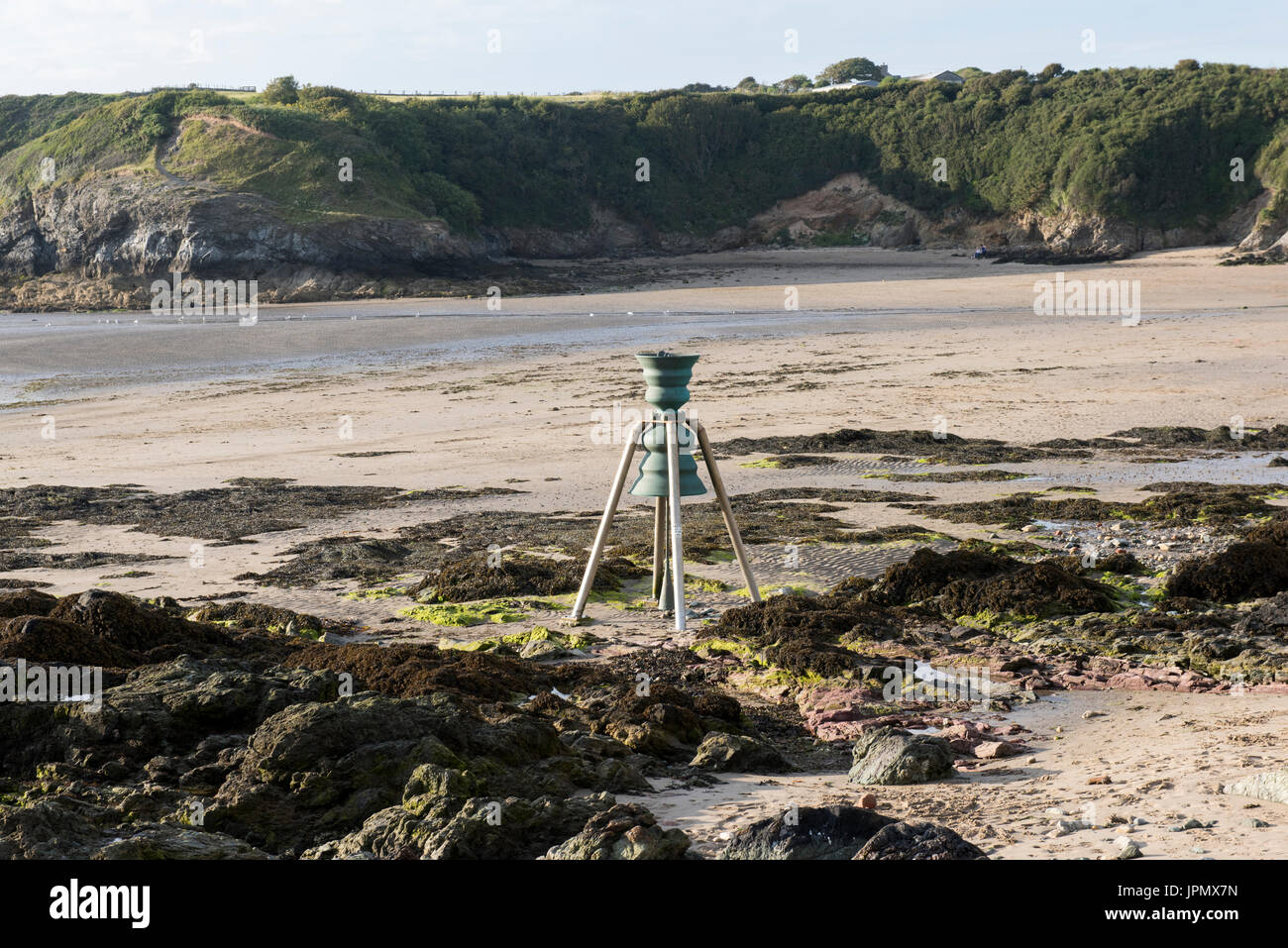 The Time and Tide Bell (St Patrick's Bell) on the beach in Cemaes Bay ...