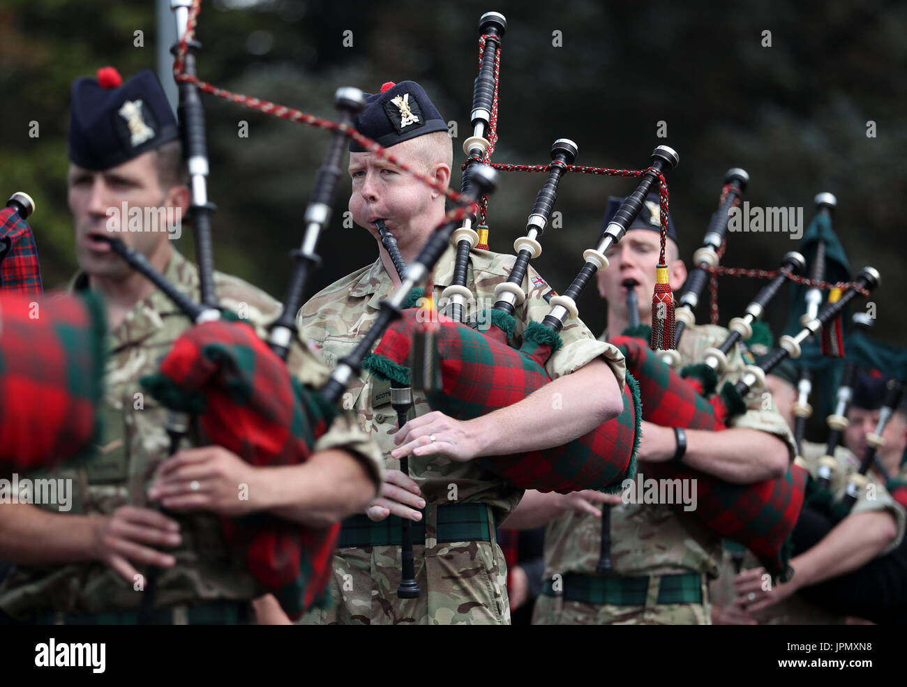 Members of the Royal Regiment of Scotland (2 SCOTS) massed pipes and ...