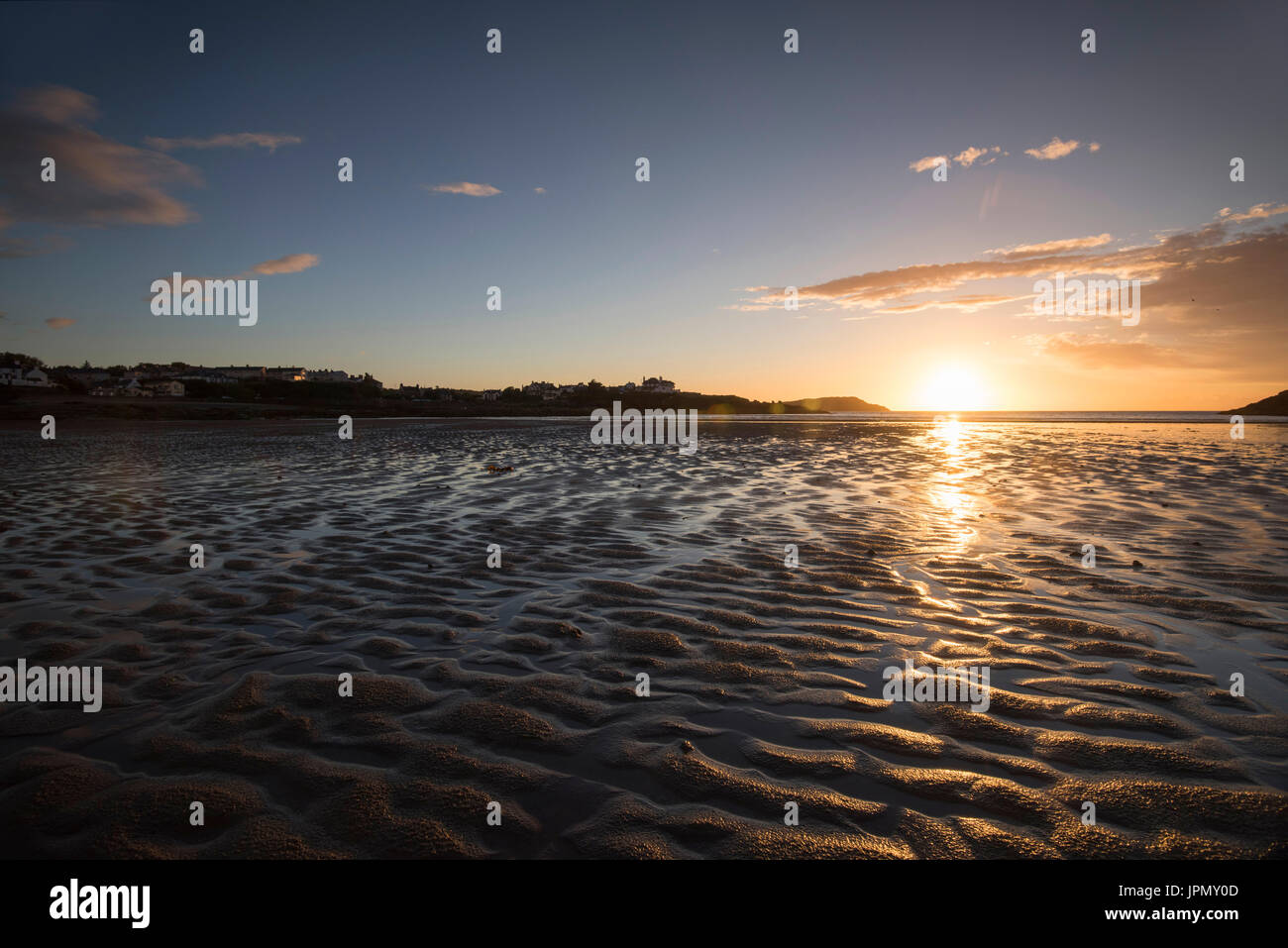 Sunset on the beach at low tide in Cemaes Bay, Anglesey Wales UK Stock ...