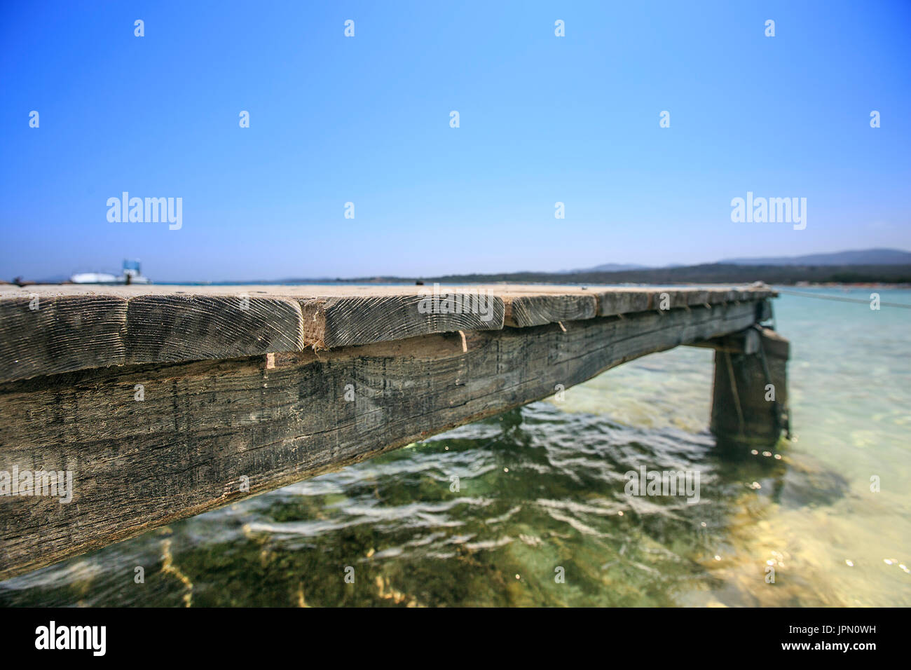 Wooden pier in a beautiful beach Stock Photo - Alamy