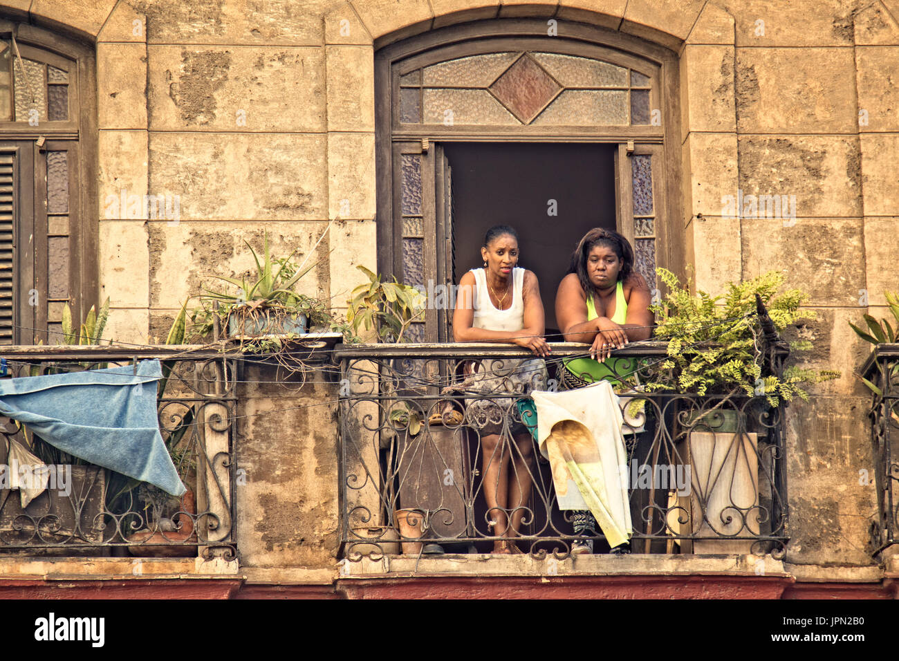 Two people talking on balcony hi-res stock photography and images - Alamy