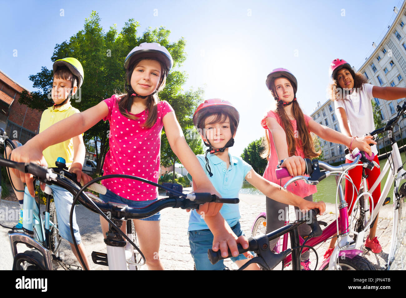 Children standing street bicycles hi-res stock photography and images ...