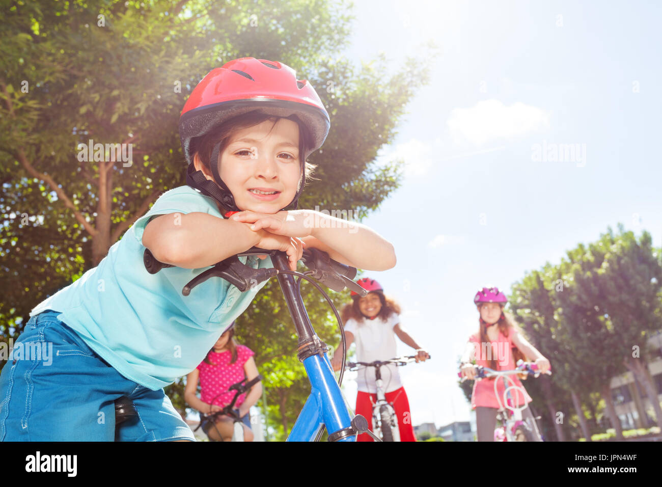 Boy wheeling bike hi-res stock photography and images - Alamy