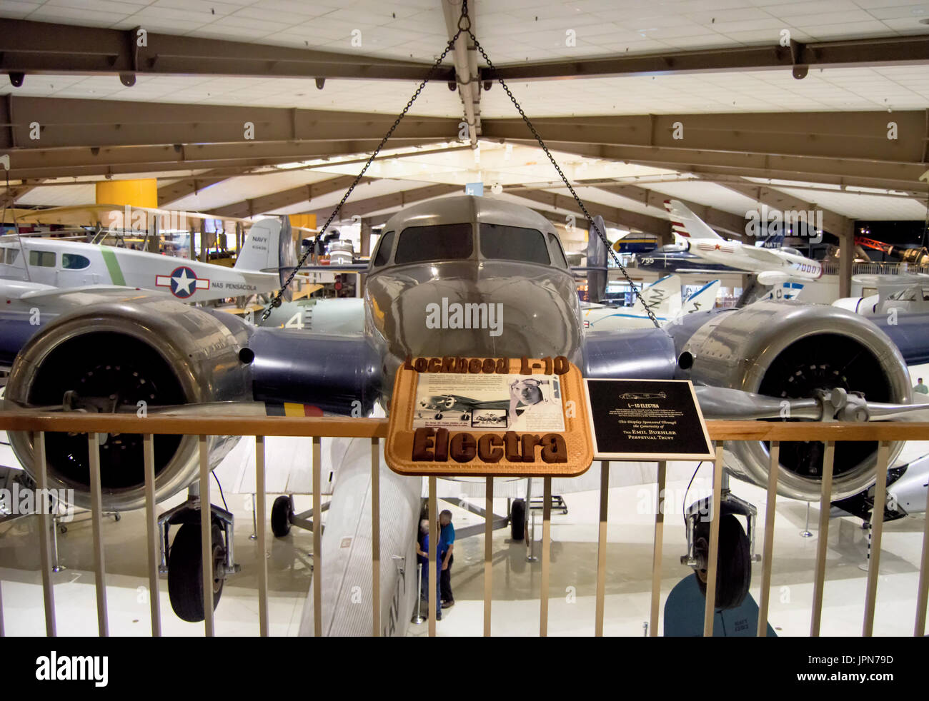 A gray jet electra plane on display at the national museum of naval ...