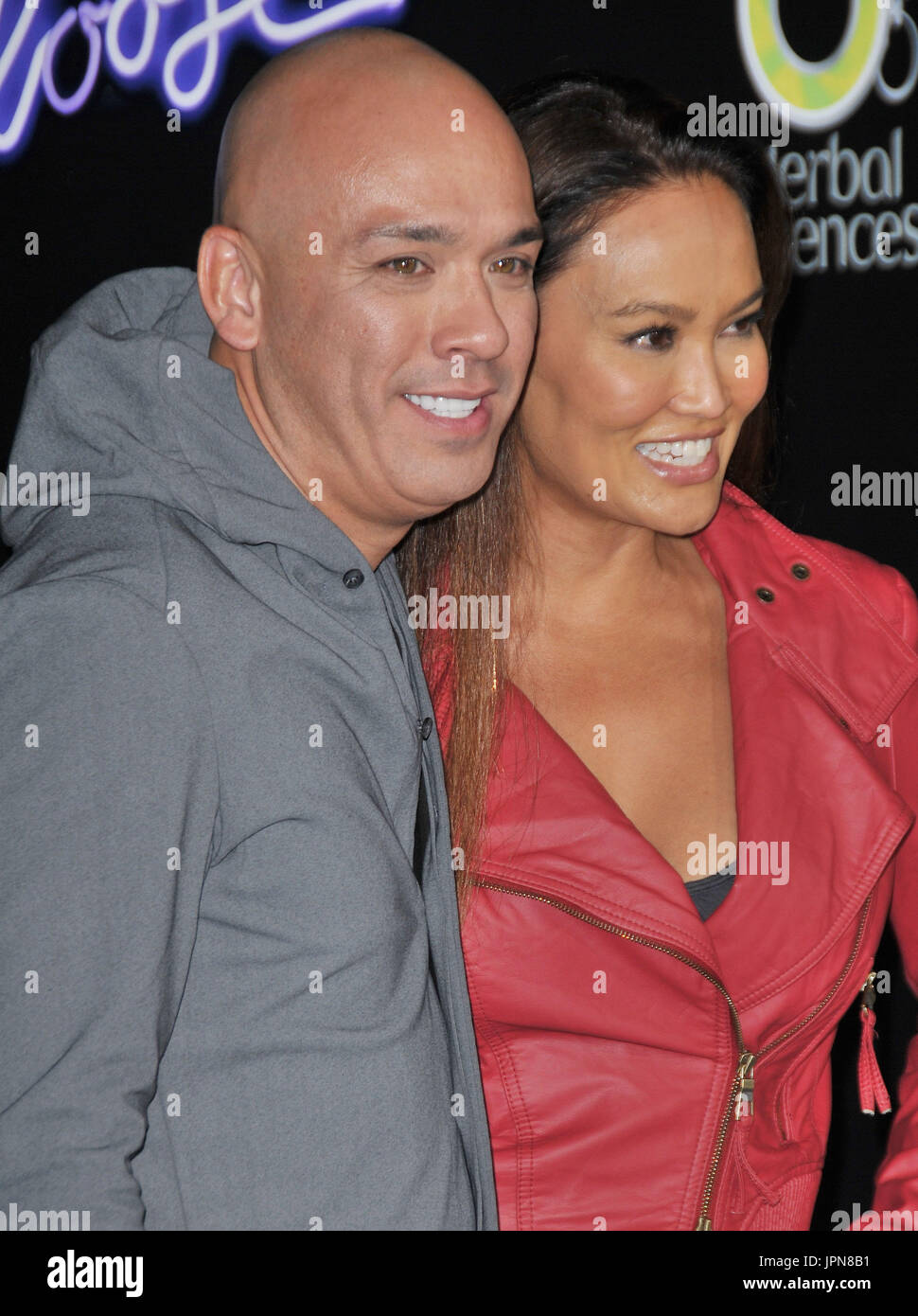 Jokoy & Tia Carrere at the Los Angeles Premiere of "Footloose" held at ...